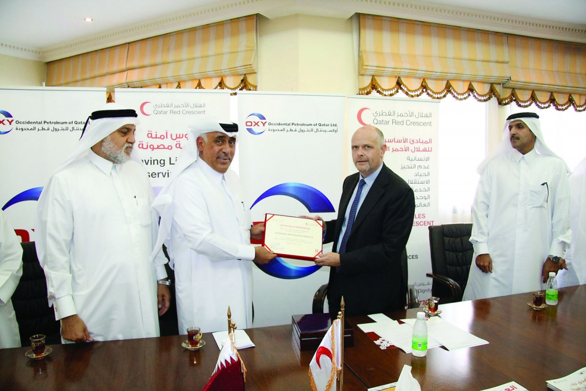 QRCS and Oxy Qatar give financial aid to poor families in Qatar | The ...