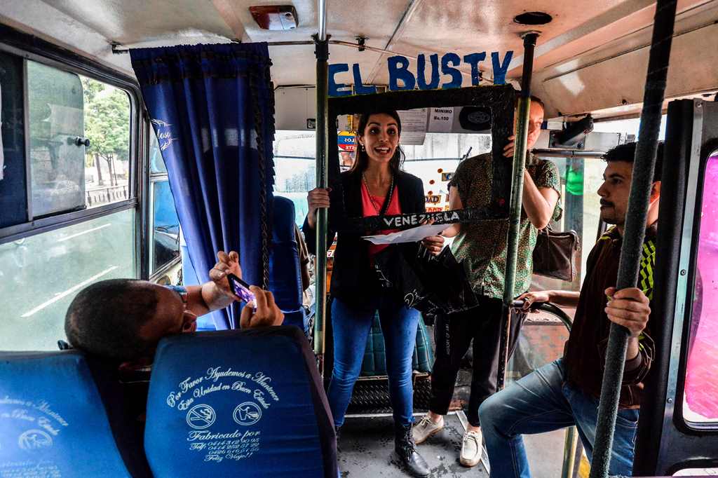 Venezuelans watch news bulletins acted live on bus | The Peninsula Qatar