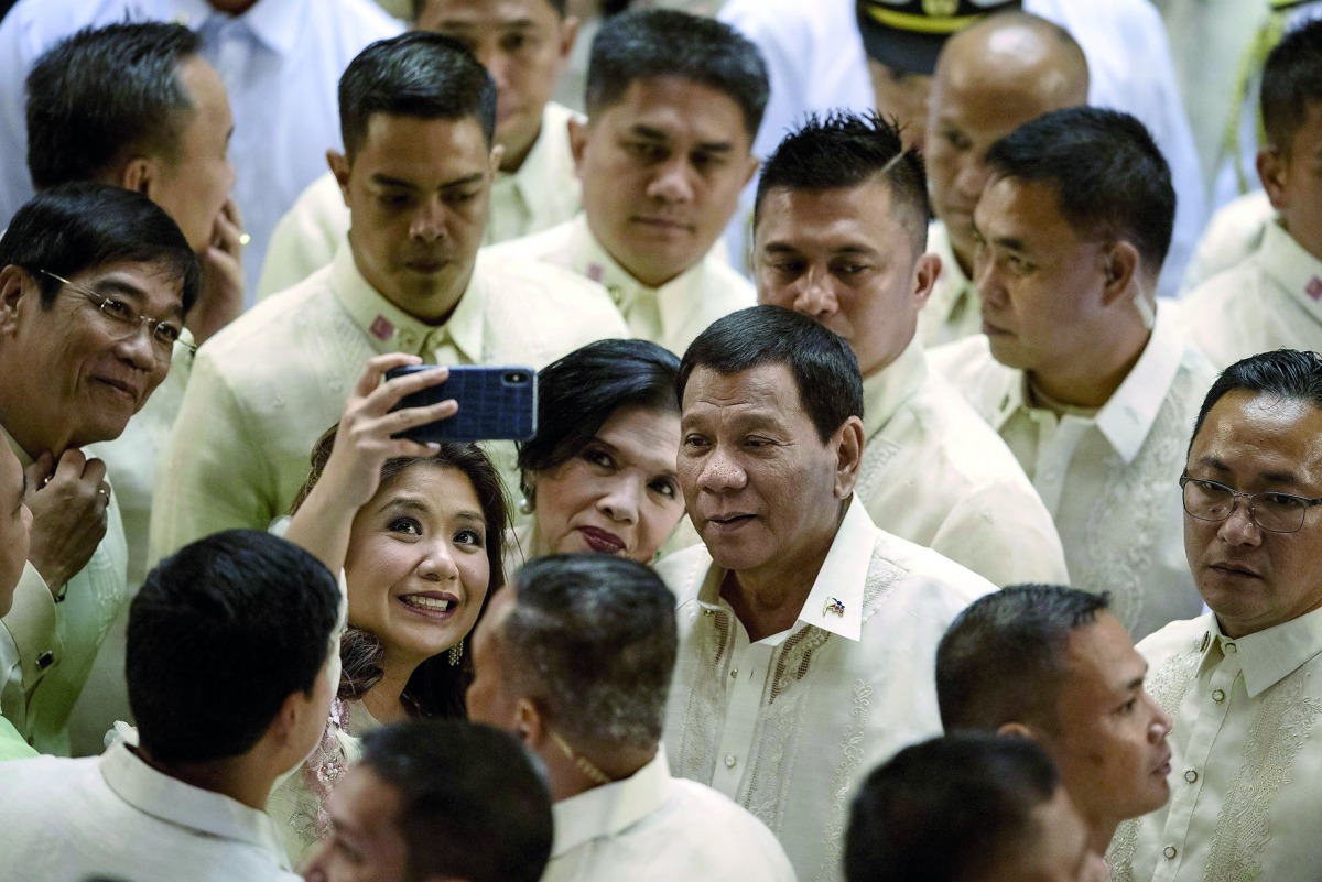 Duterte approves autonomy law for troubled Muslim region | The ...