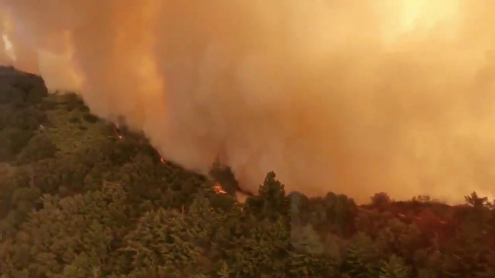Massive wildfire rages after becoming largest in California's history ...