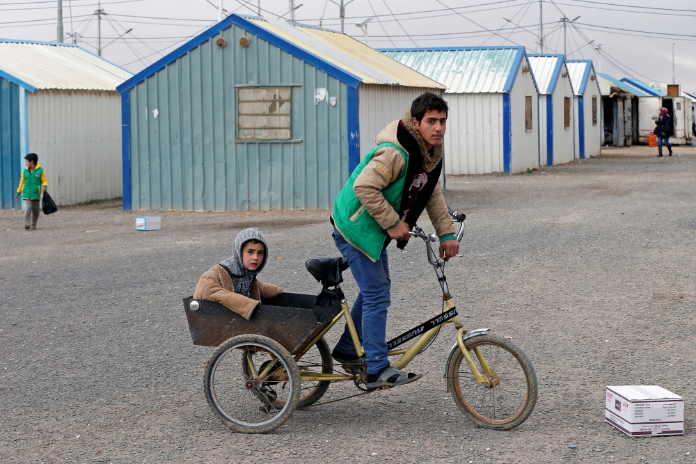Defying war and catcalls, Syria's women hop on climate-friendly bikes ...