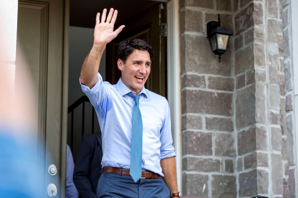 Canada's Trudeau pushes on with campaign after severe blow from ...