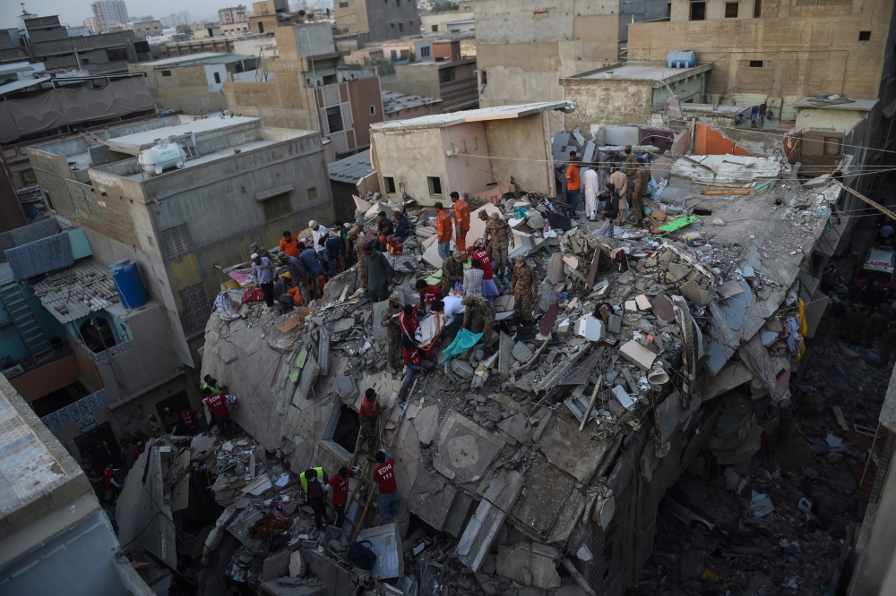 Seven missing after Pakistan building collapse as death toll hits 16 ...