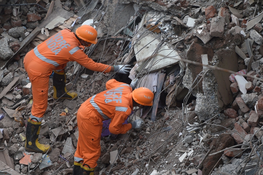 Rescuers find 60 survivors after building collapse in India | The ...