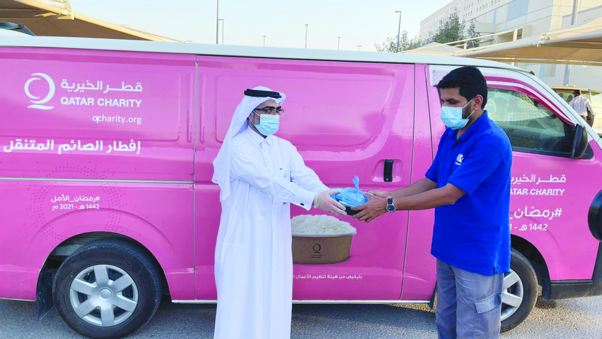 CNA-Q distributes Iftar meals to workers on campus | The Peninsula Qatar