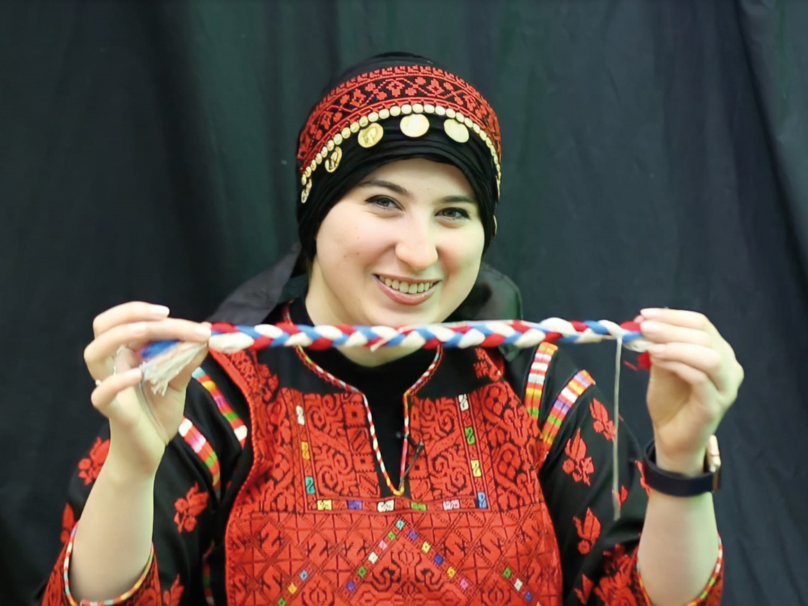 QF graduate transforms embroidery into melodies about her homeland ...