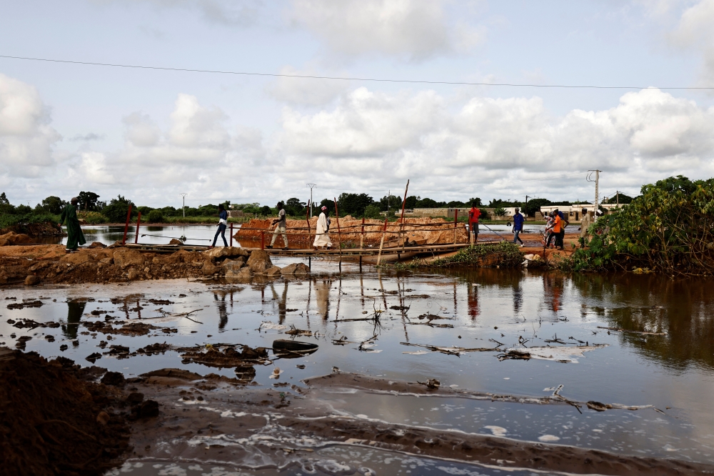 Senegal's pink lake threatened by flood waters after downpour | The ...