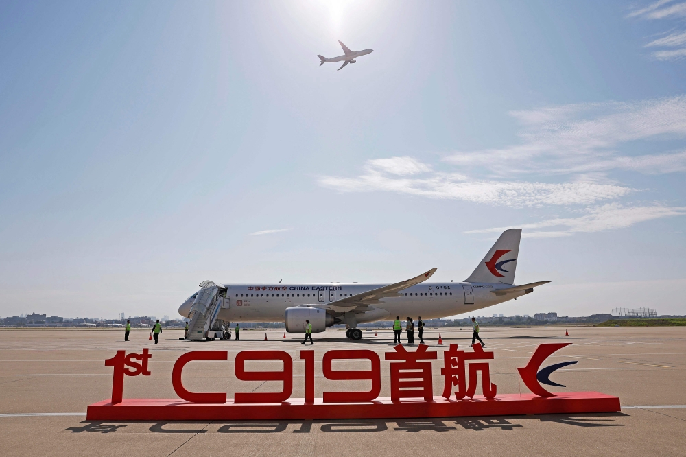 China's first homegrown passenger jet makes maiden commercial flight ...