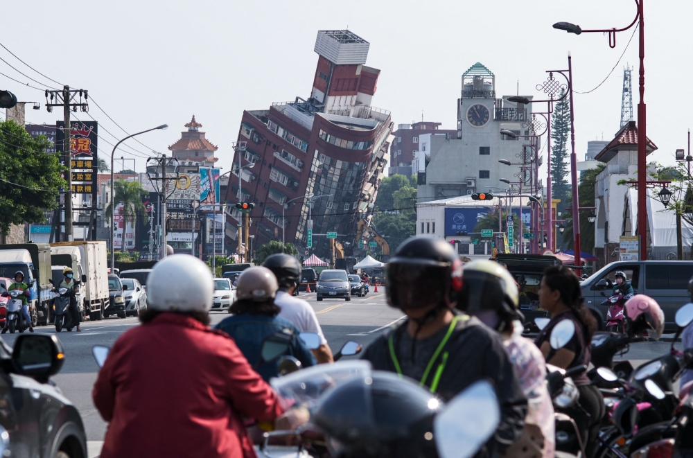 Families shelter in tents as rescuers seek people cut off by Taiwan ...