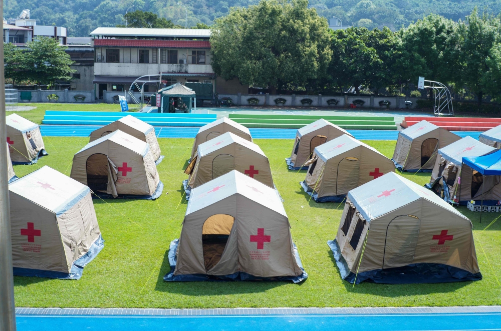 Families shelter in tents as rescuers seek people cut off by Taiwan ...