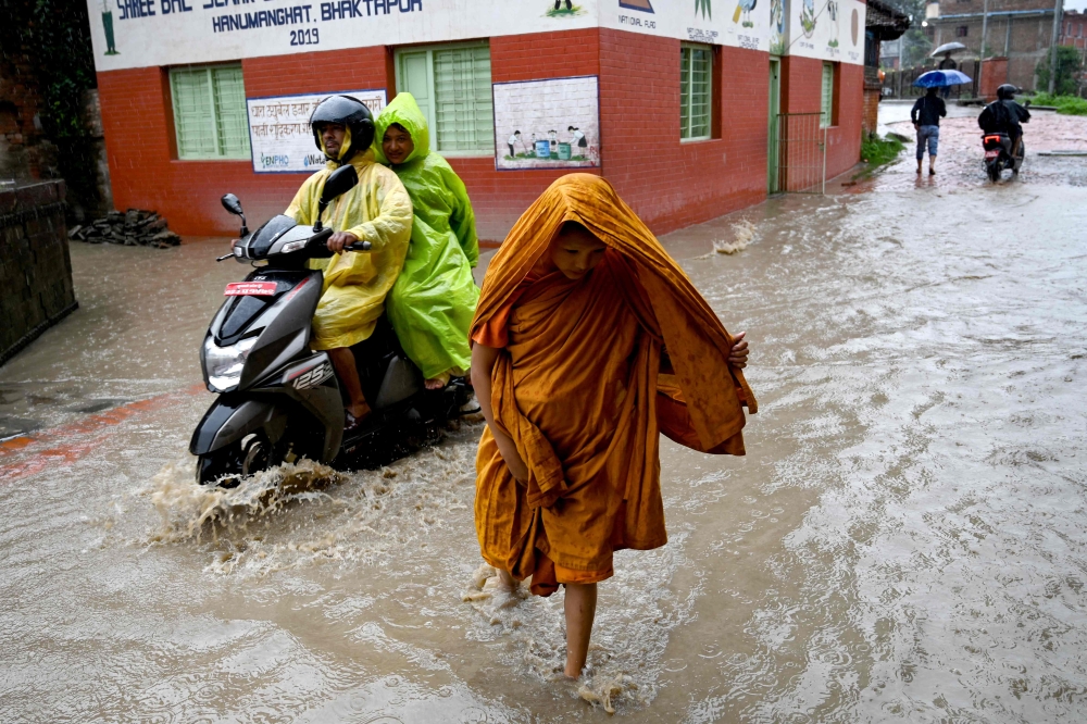 Floods and landslides kill 14 in Nepal: police | The Peninsula Qatar