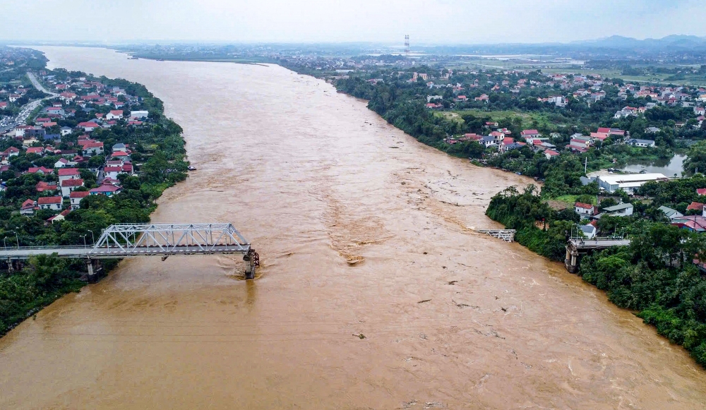 Vietnam storm deaths rise to 64 as a bridge collapses and flooding ...