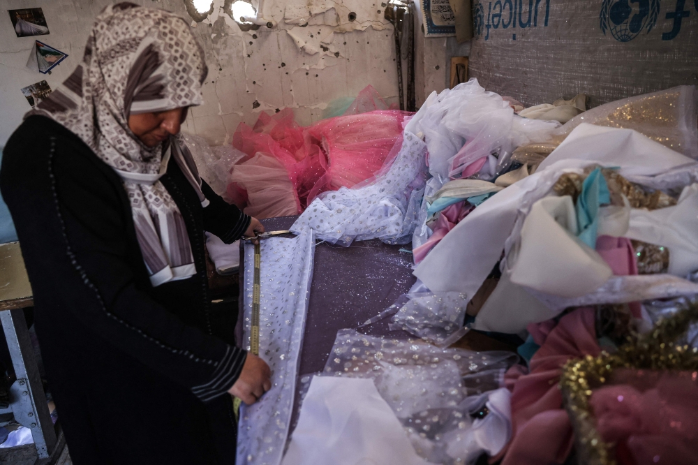 Gaza tailor turns waste fabrics into dresses for girls | The Peninsula ...